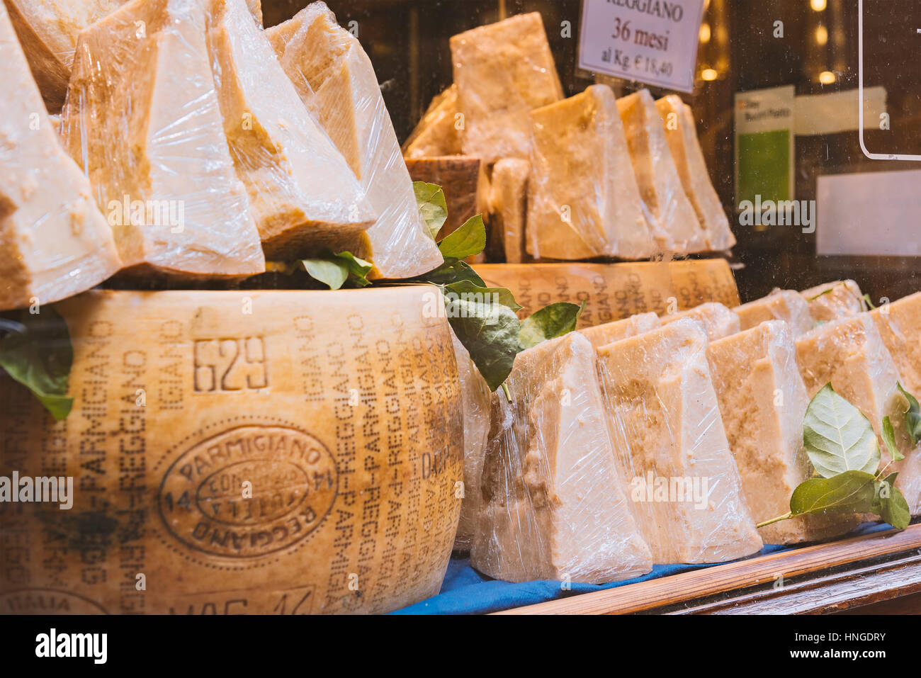 Shop window display of local cheese shop selling Parmigiano Reggiano ...