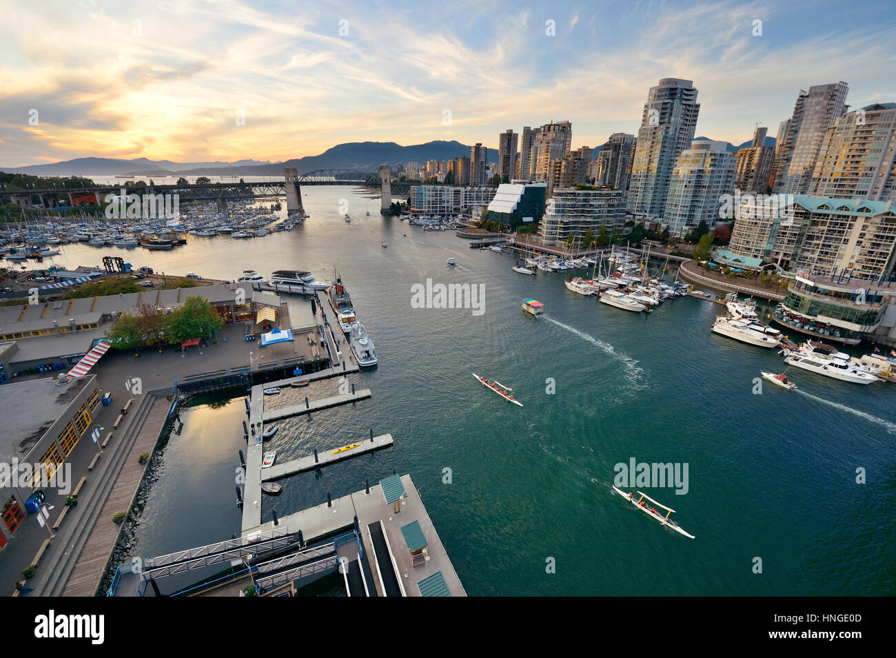 Vancouver harbor view with urban apartment buildings and bay boat in ...