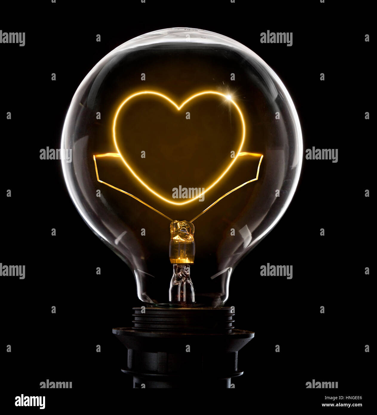 Clean and shiny lightbulb with a heart as a glowing wire.(series Stock ...