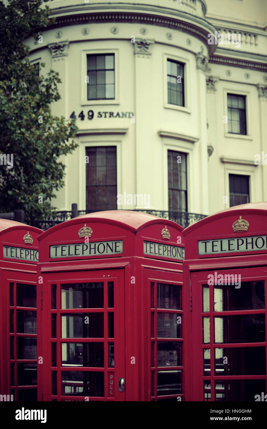 Red telephone box in street with historical architecture in London ...