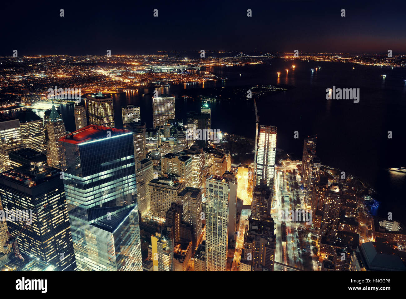 Rooftop night view of New York City downtown with urban skyscrapers ...