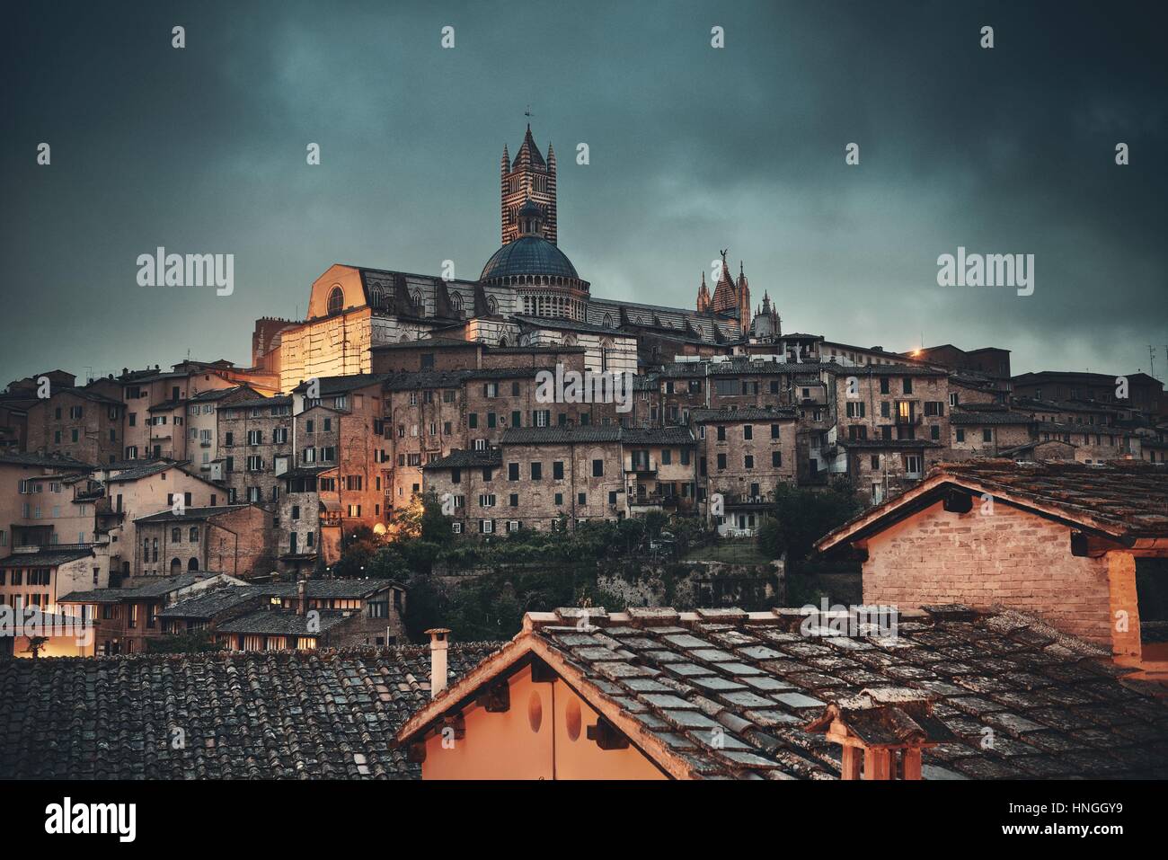 Medieval town skyline view with Siena Cathedral and historic buildings ...