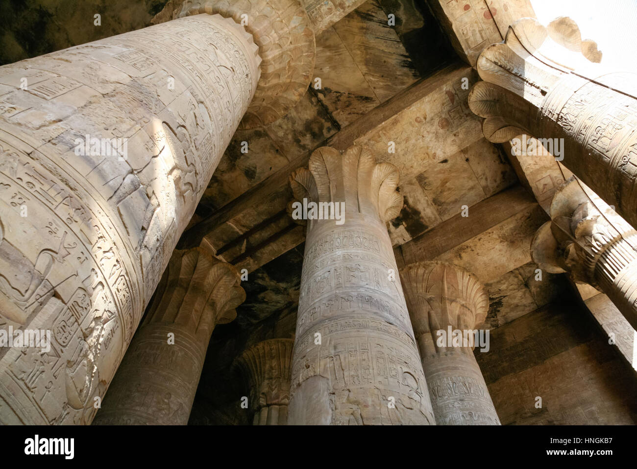 big stone columns in Egyptian Edfu Temple of falcon god Horus, with ...