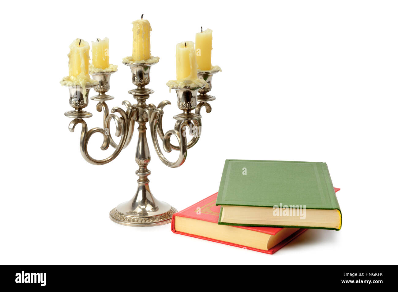 candlestick and books isolated on white background Stock Photo - Alamy
