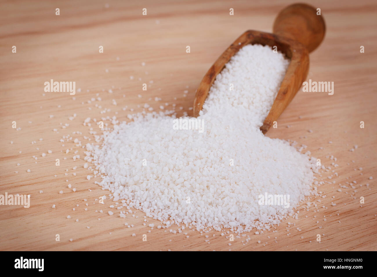 Granulated cassava (tapioca) on wooden background. Selective focus ...