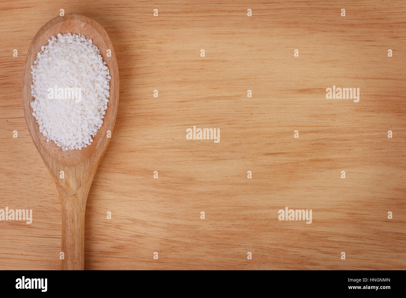 Granulated cassava (tapioca) on wooden background. Selective focus ...