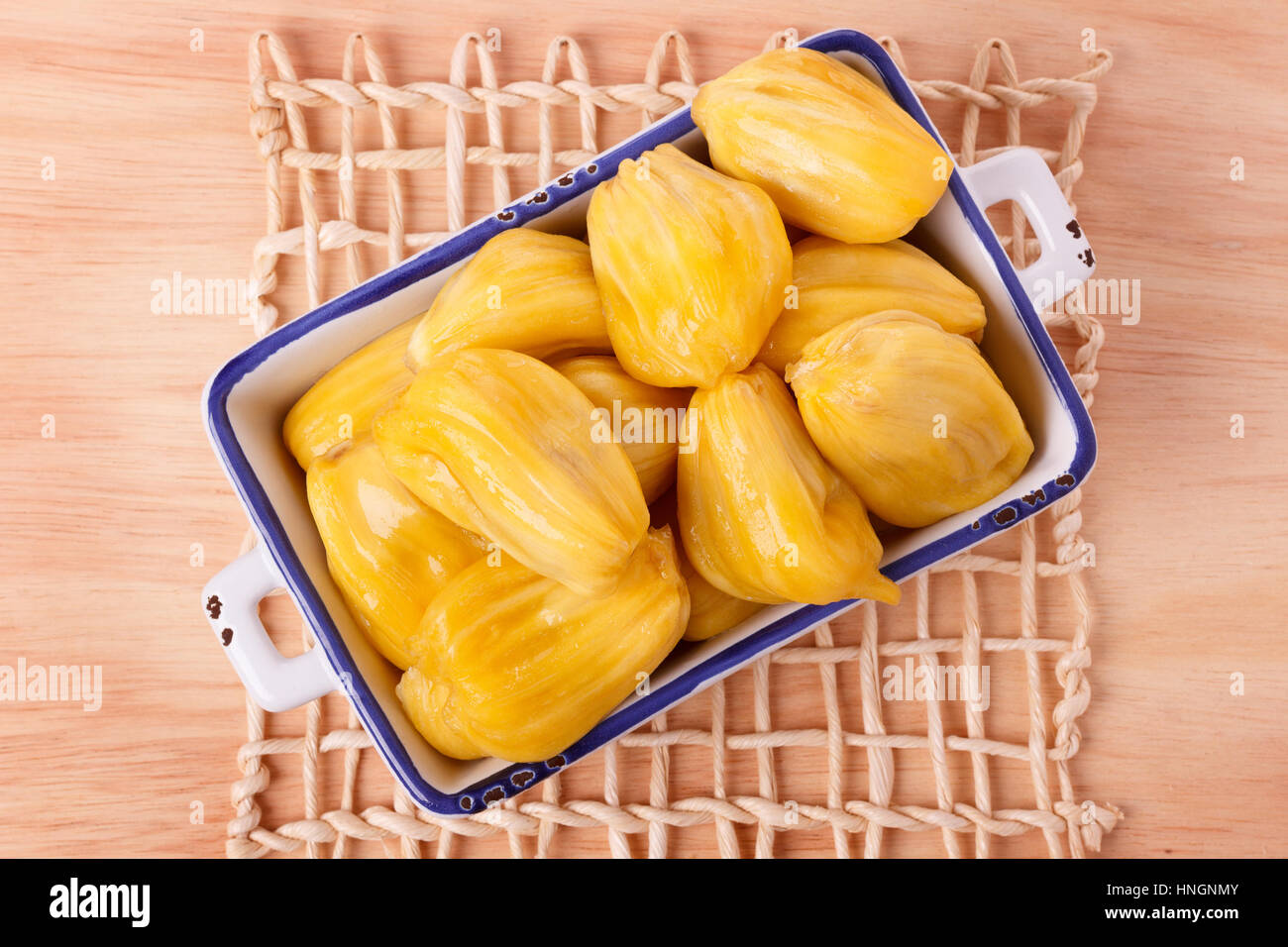 Tropical fruit Jackfruit (jakfruit, jack, jak) in bowl on wooden table ...