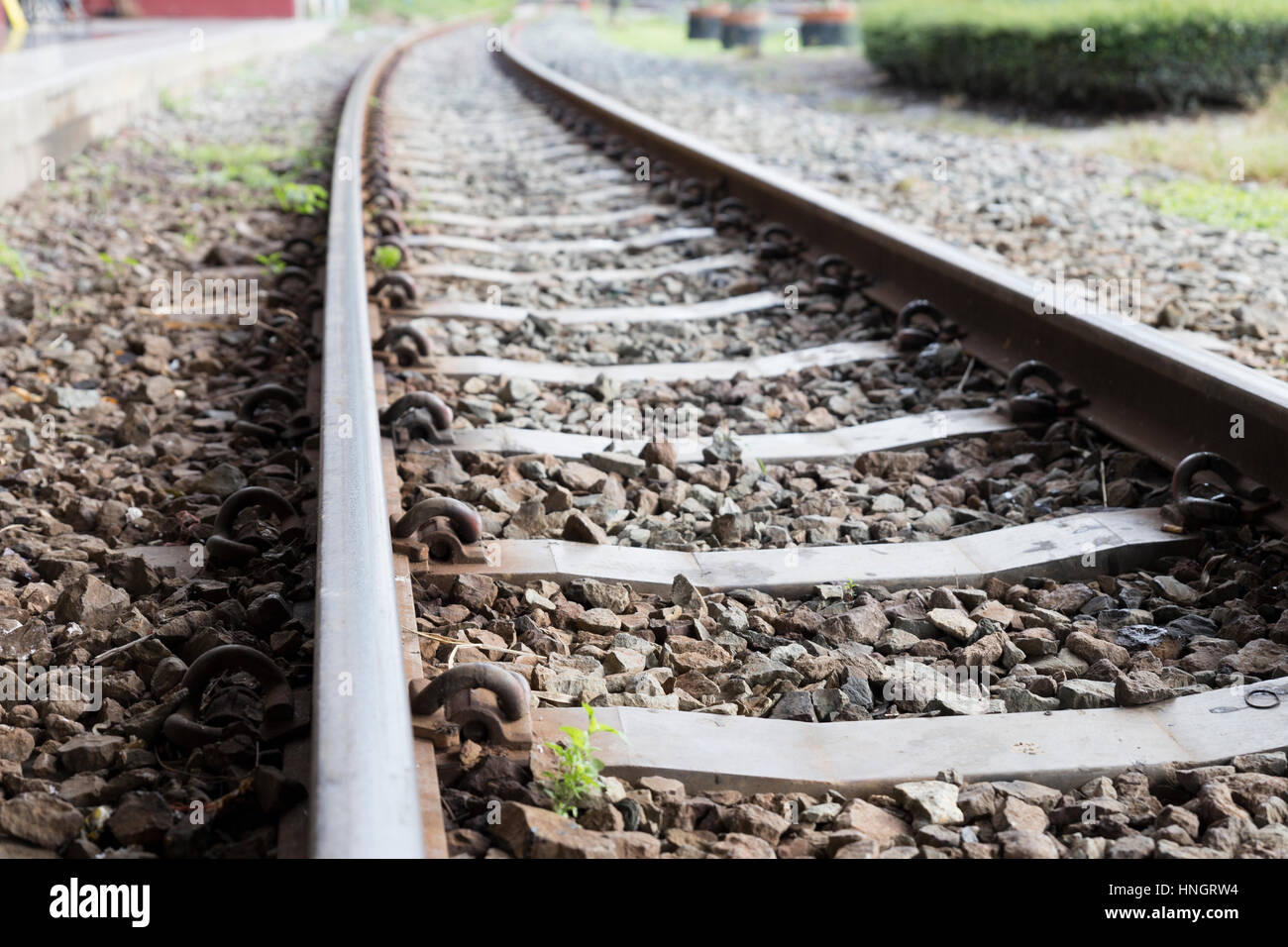 railroad railway track at train station Stock Photo - Alamy