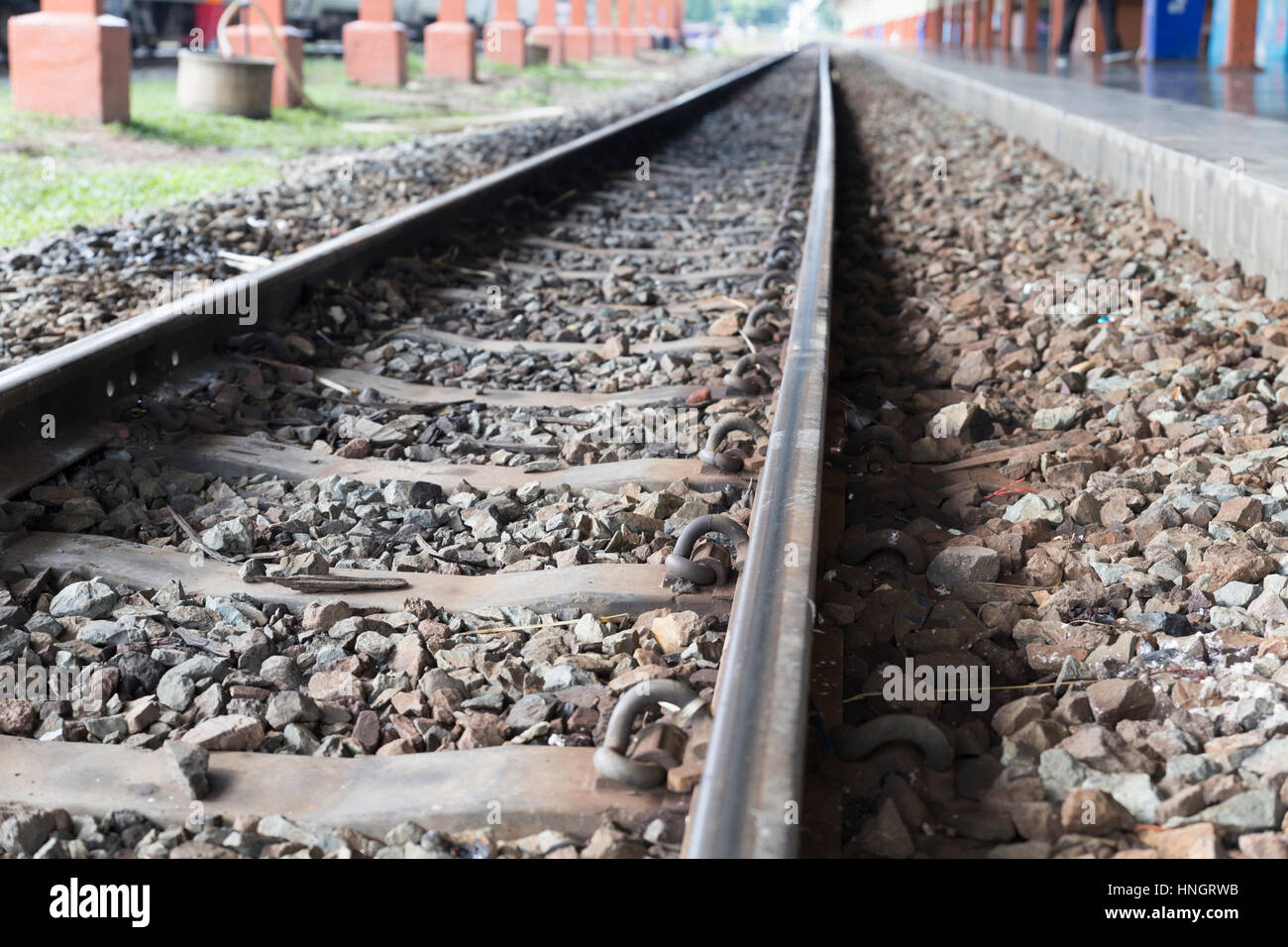 railroad railway track at train station Stock Photo - Alamy
