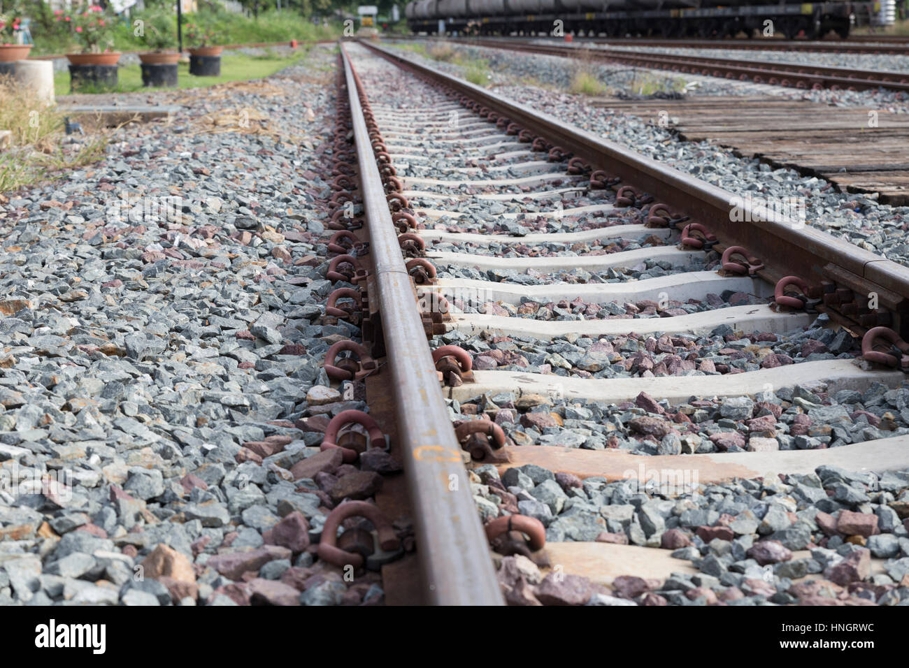 railroad railway track at train station Stock Photo - Alamy