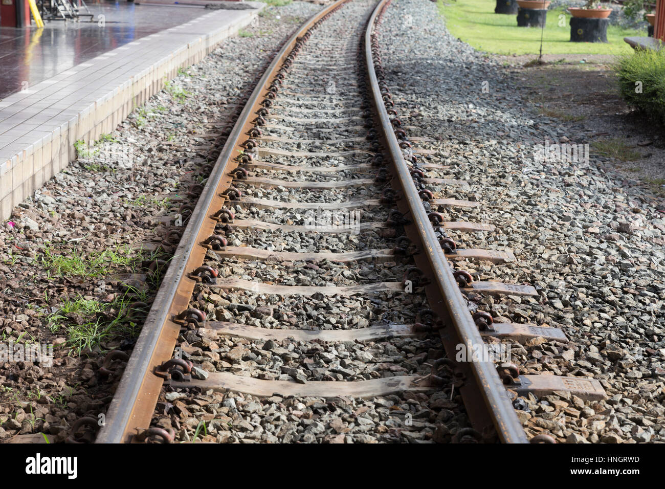 railroad railway track at train station Stock Photo - Alamy