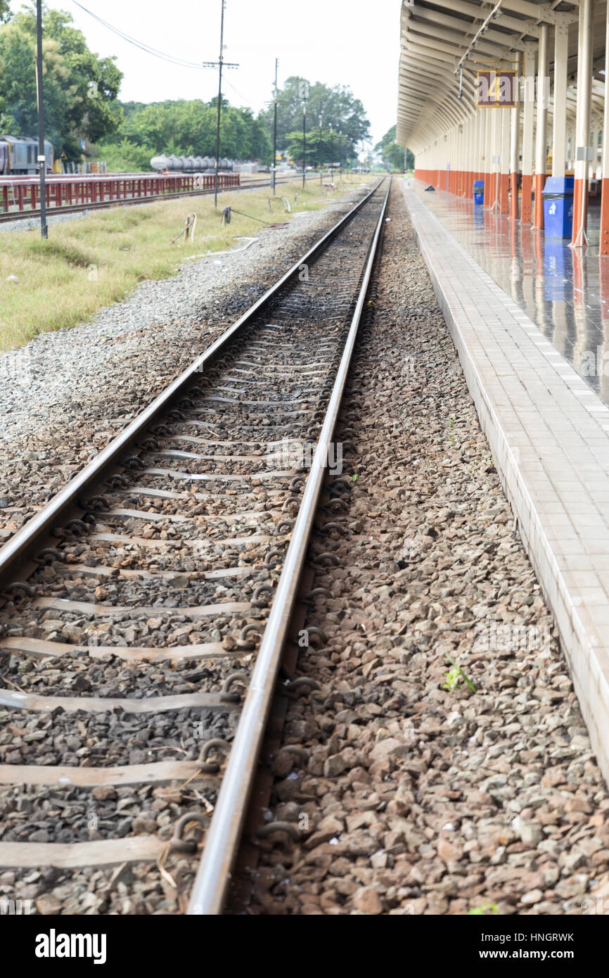 railroad railway track at train station Stock Photo - Alamy