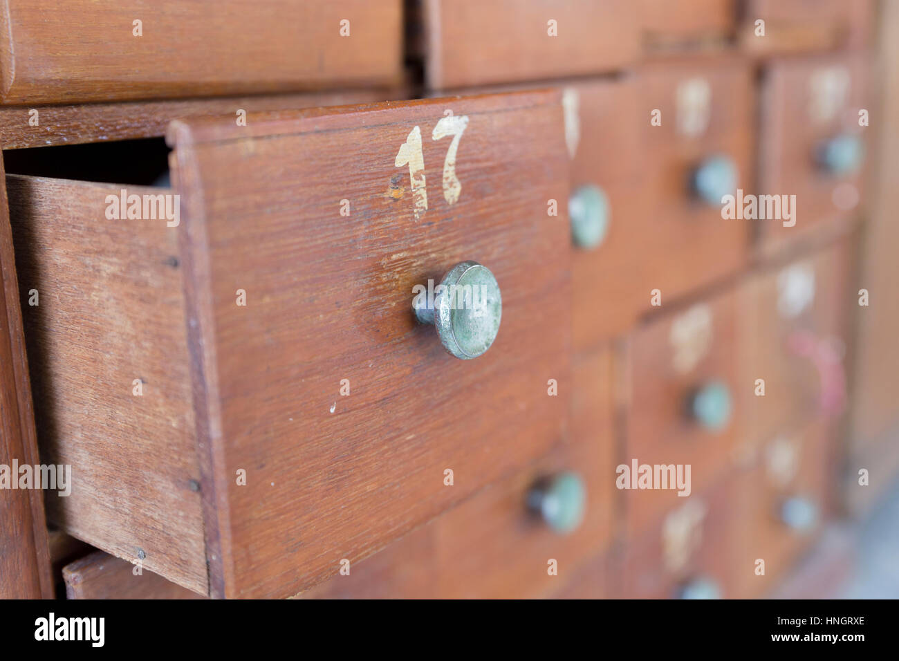 wooden drawer of old cabinet with number Stock Photo - Alamy