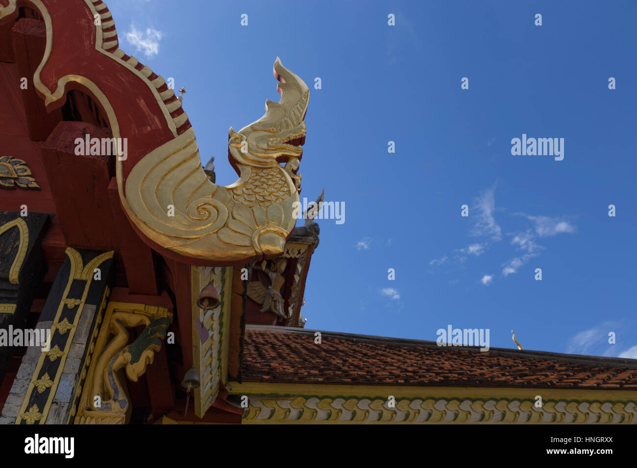 golden naga sculpture in buddhism temple Stock Photo - Alamy