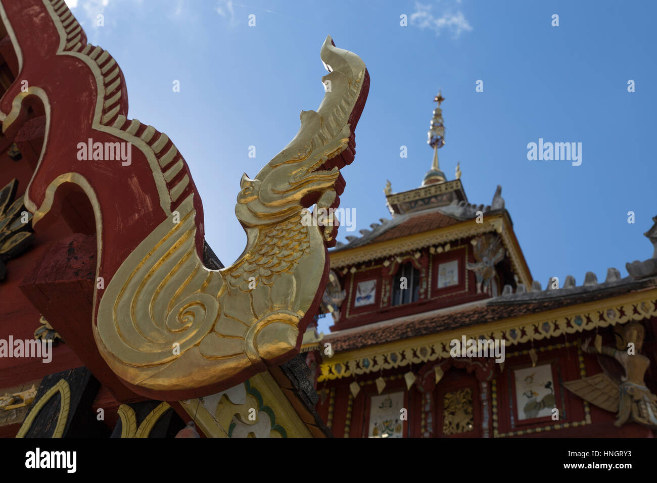golden naga sculpture in buddhism temple Stock Photo - Alamy