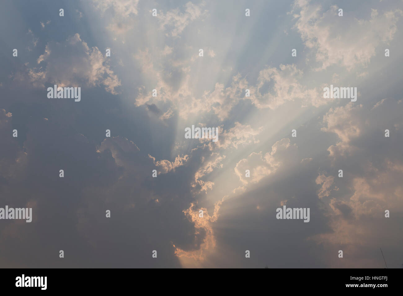 sunlight through cloud in evening Stock Photo - Alamy