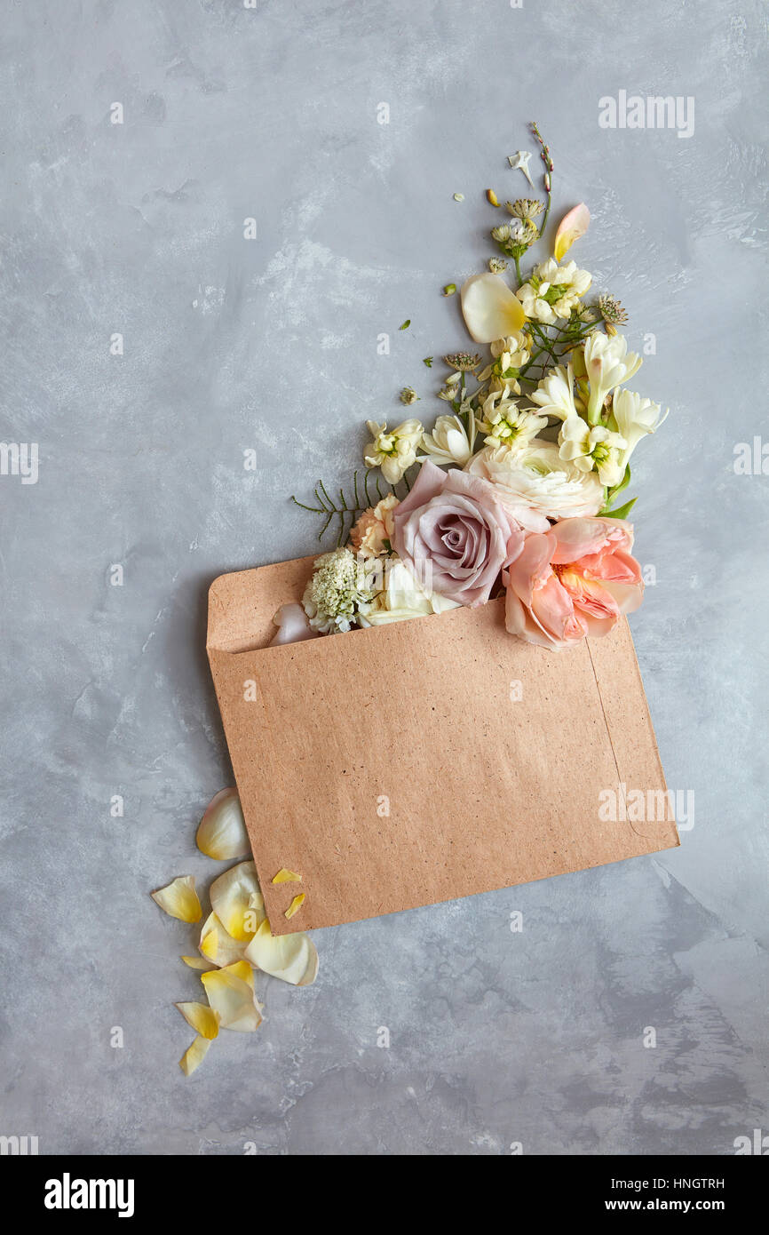 The message in the letter. Beautiful bouquet of flowers in an envelope ...