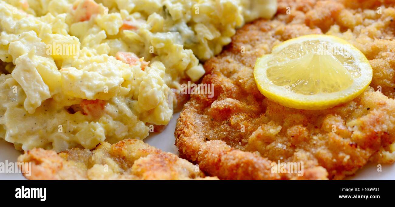 Traditional fried pork schnitzel with Czech potato mayonnaise salad and ...