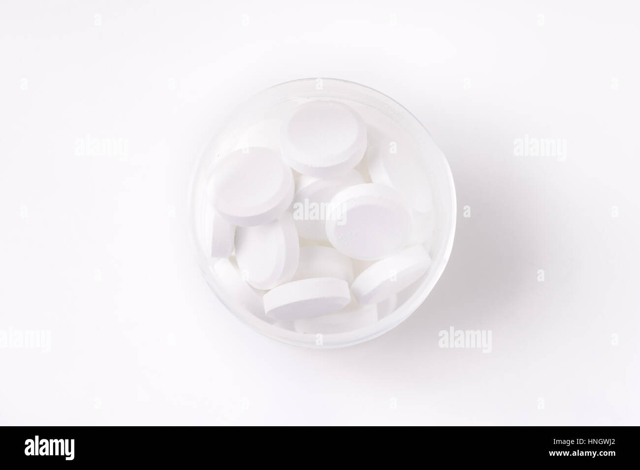 pile of white tablets isolated on white background Stock Photo - Alamy