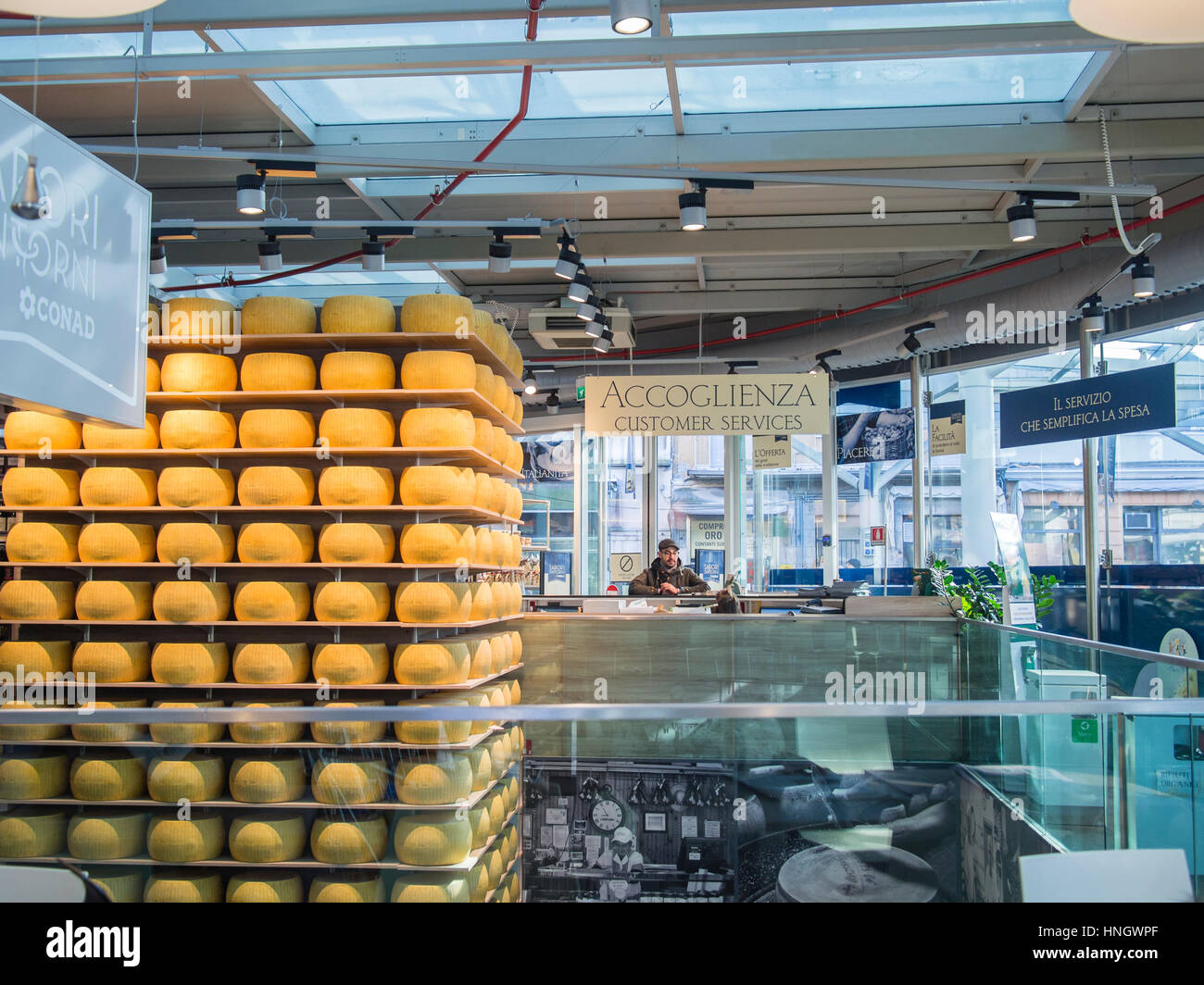 Many block of original parmigiano reggiano parmesan cheese in display ...