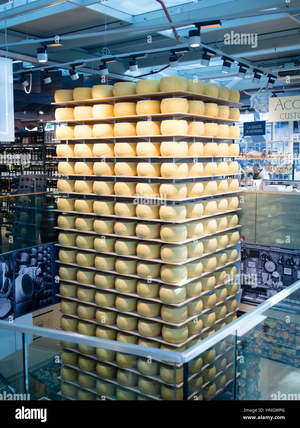 Many block of original parmigiano reggiano parmesan cheese in display ...
