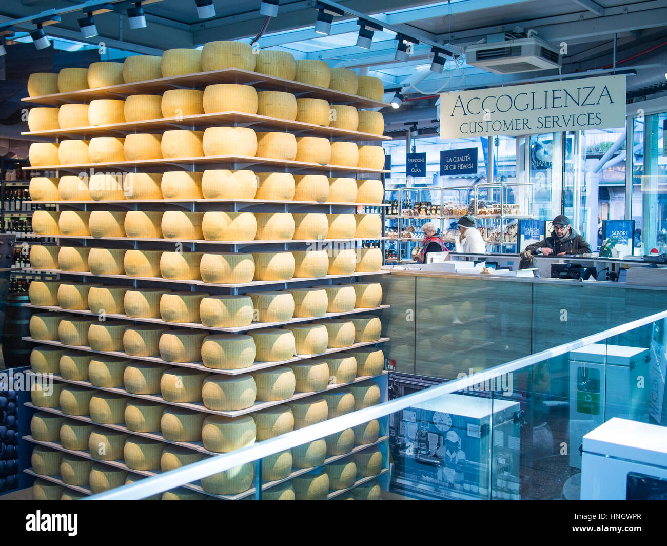 Many block of original parmigiano reggiano parmesan cheese in display ...