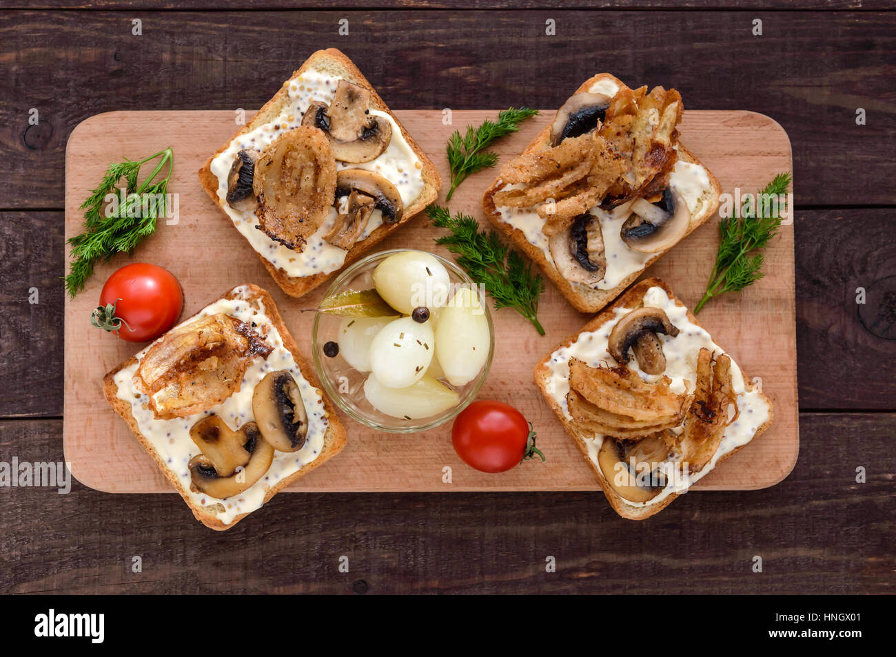 Crispy toasted white bread in the shape of a square with mushrooms ...