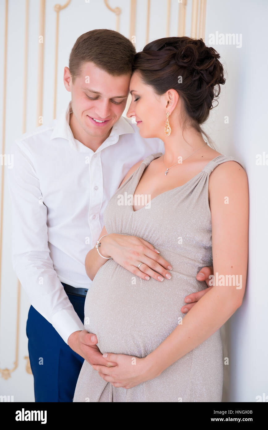 Beautiful pregnant couple expecting baby. Happiness life Stock Photo ...