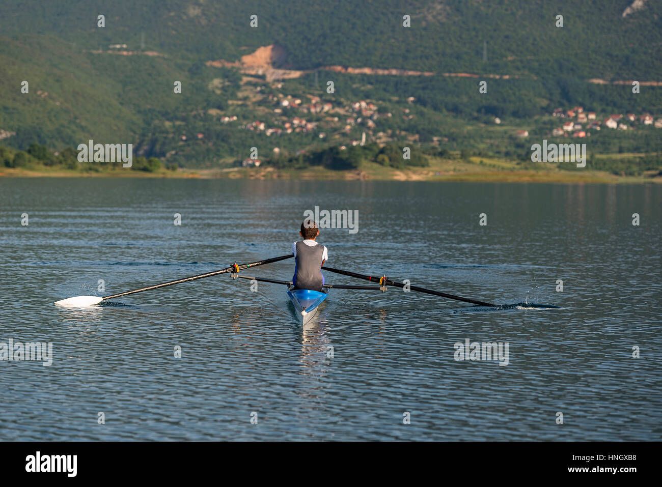 Child in the course of rowing on single Stock Photo - Alamy