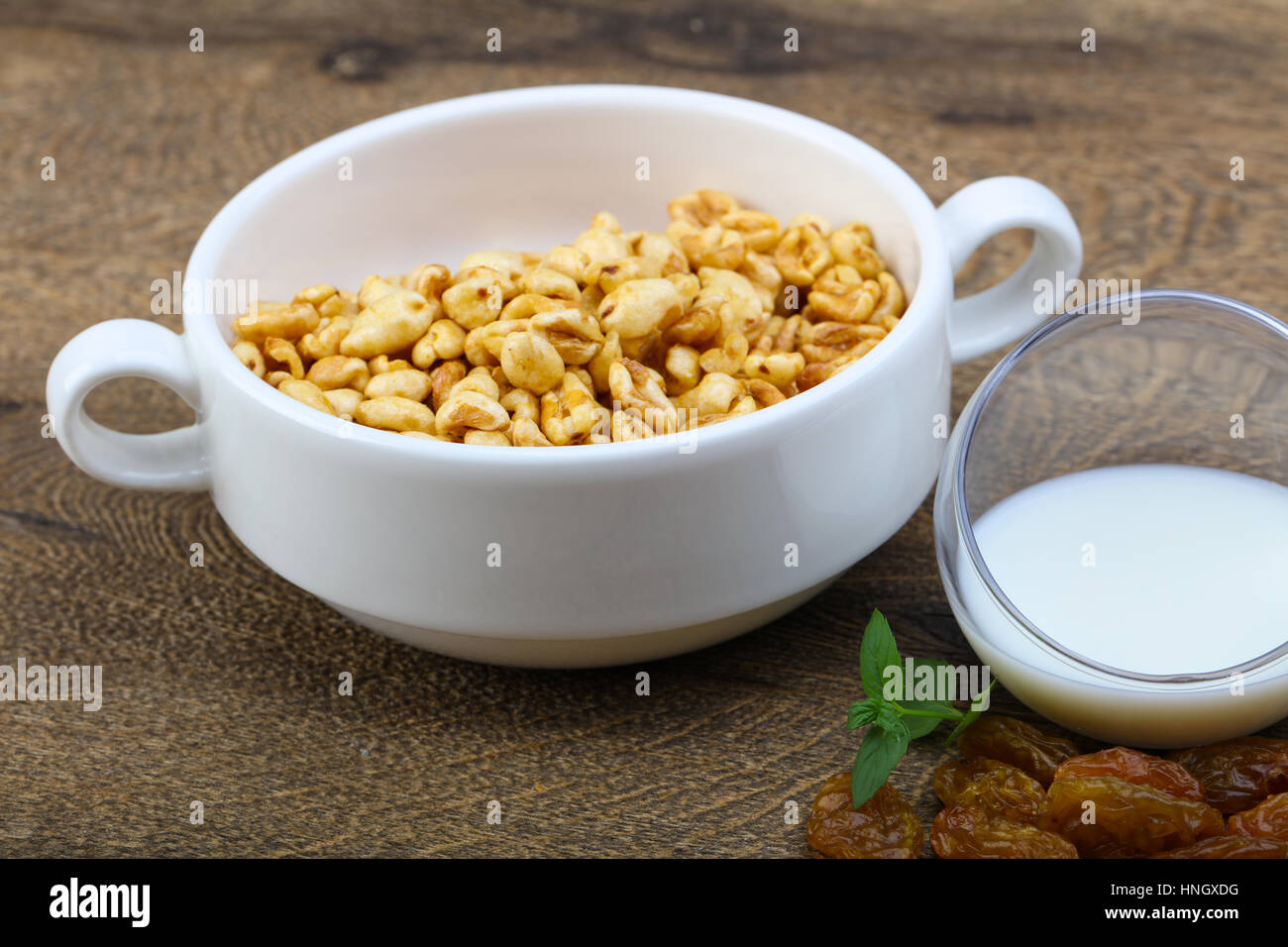 Rise flakes with milk, raisin and mint leaves Stock Photo - Alamy