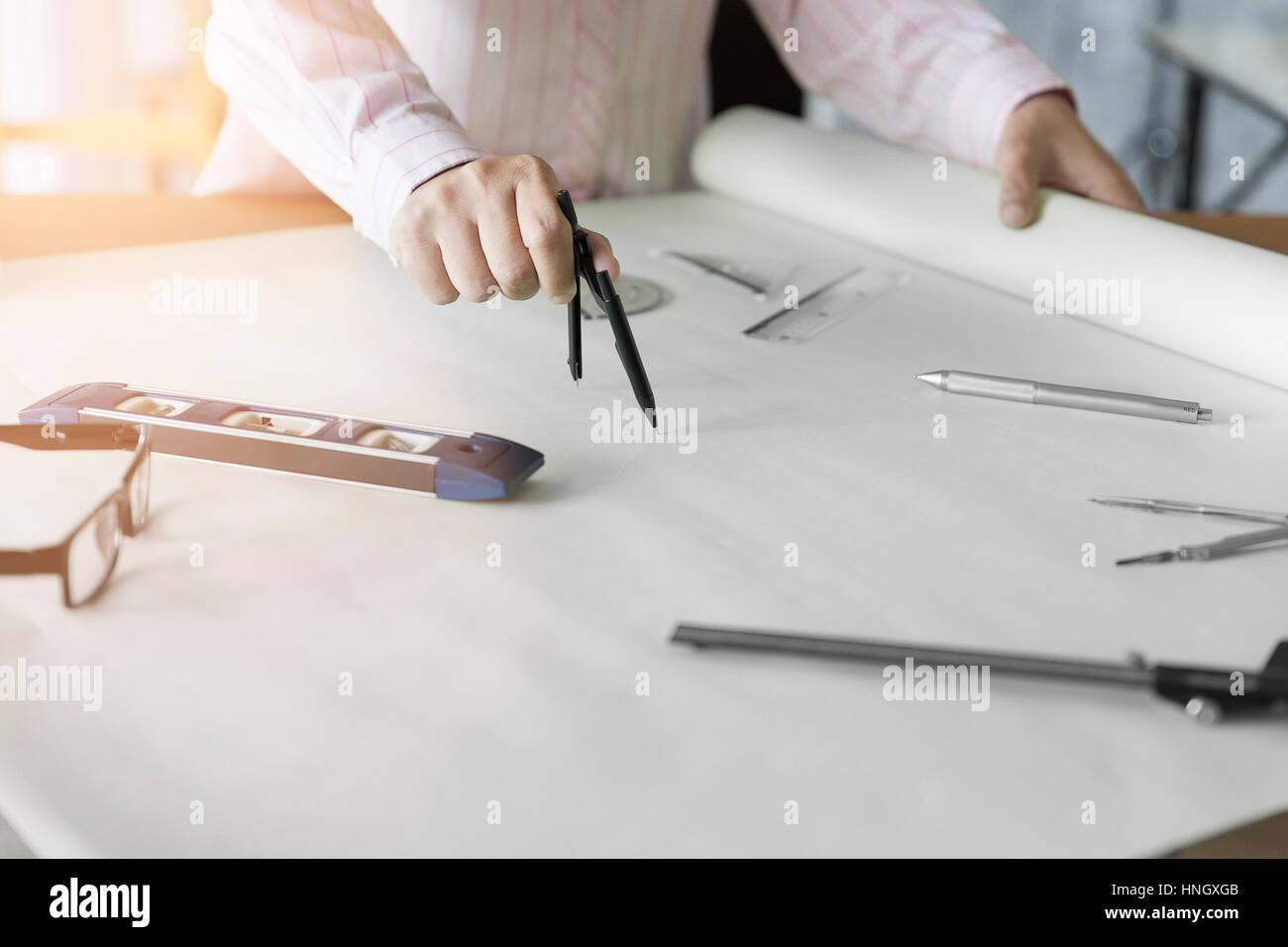 architect hand holding compass working on construction engineering ...