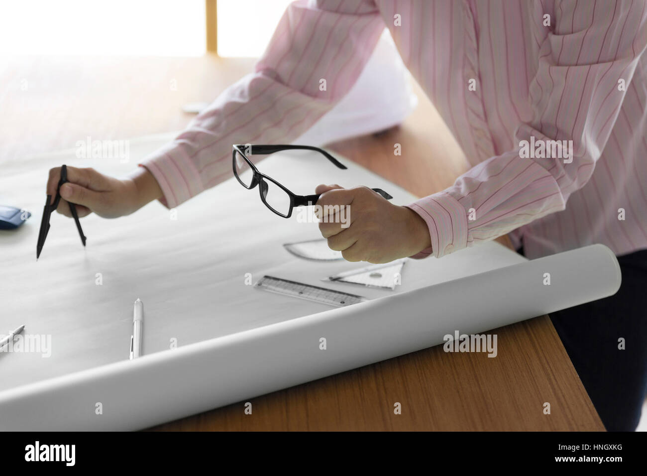 architect hand holding compass working on construction engineering ...