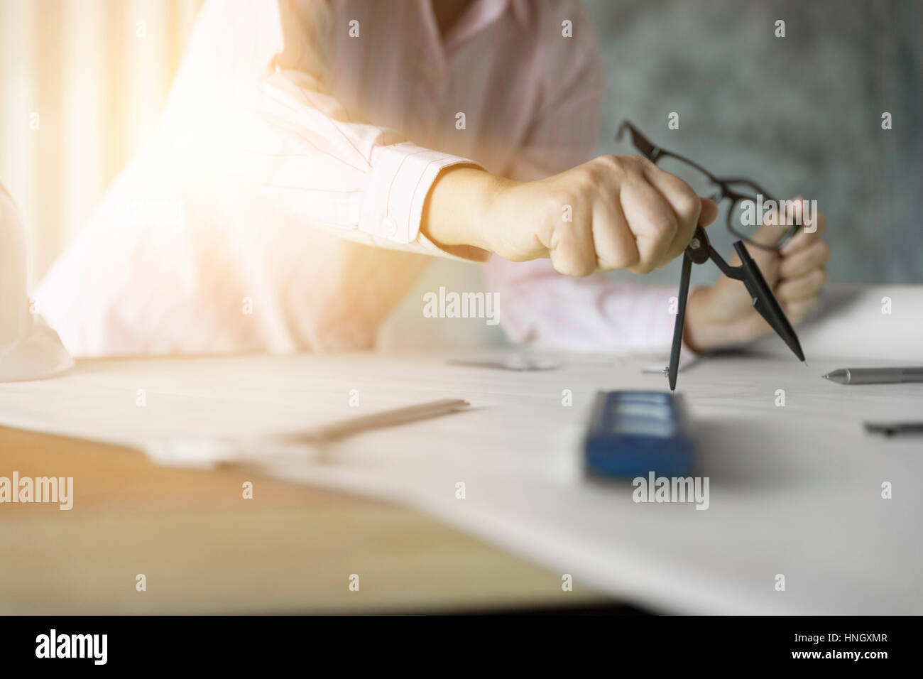 architect hand holding compass working on construction engineering ...