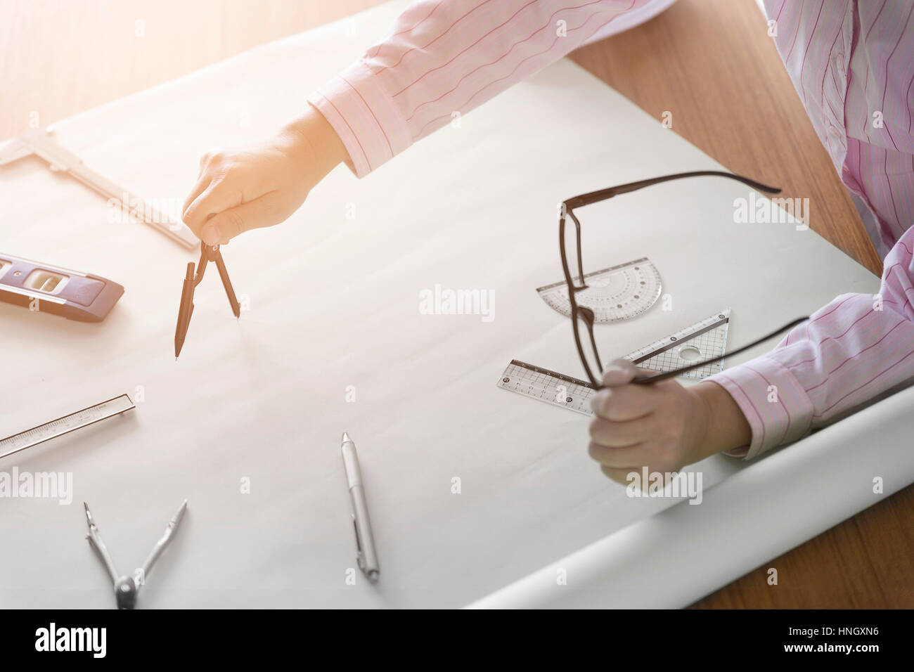 architect hand holding compass working on construction engineering ...