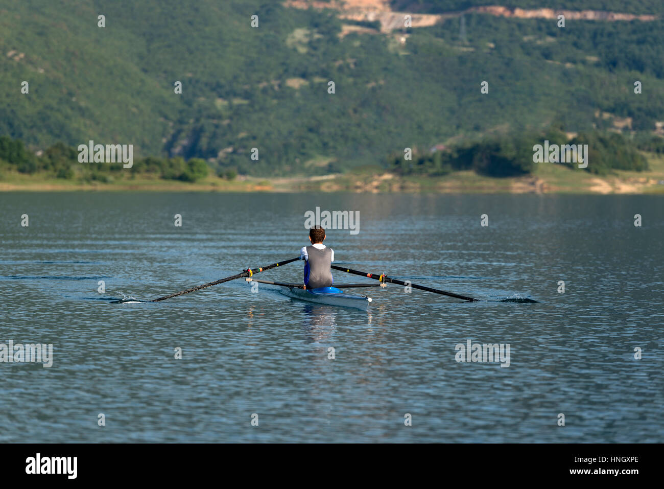 Child in the course of rowing on single Stock Photo - Alamy