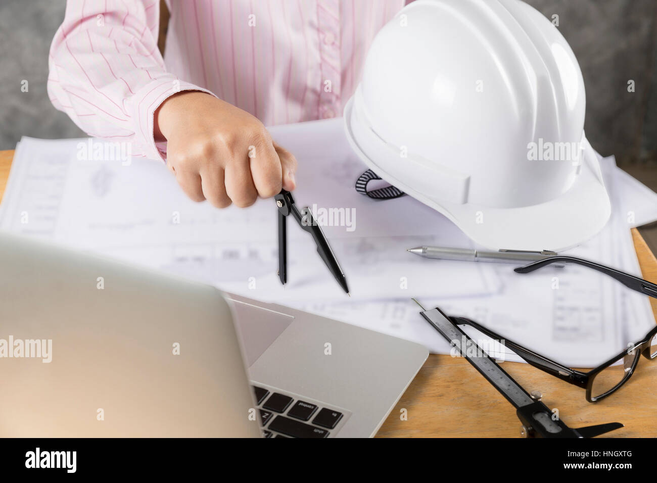 architect hand holding compass working on construction engineering ...