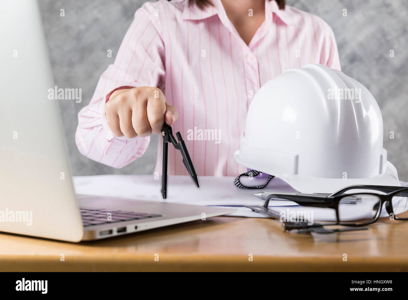 architect hand holding compass working on construction engineering ...