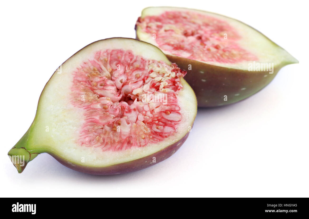 Fresh organic common fig sliced over white background Stock Photo - Alamy