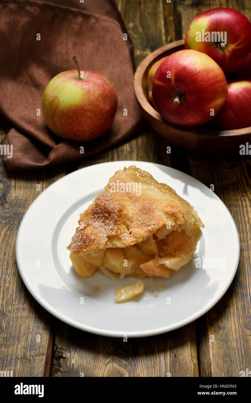 Piece of apple pie and fresh fruits on wooden table Stock Photo - Alamy