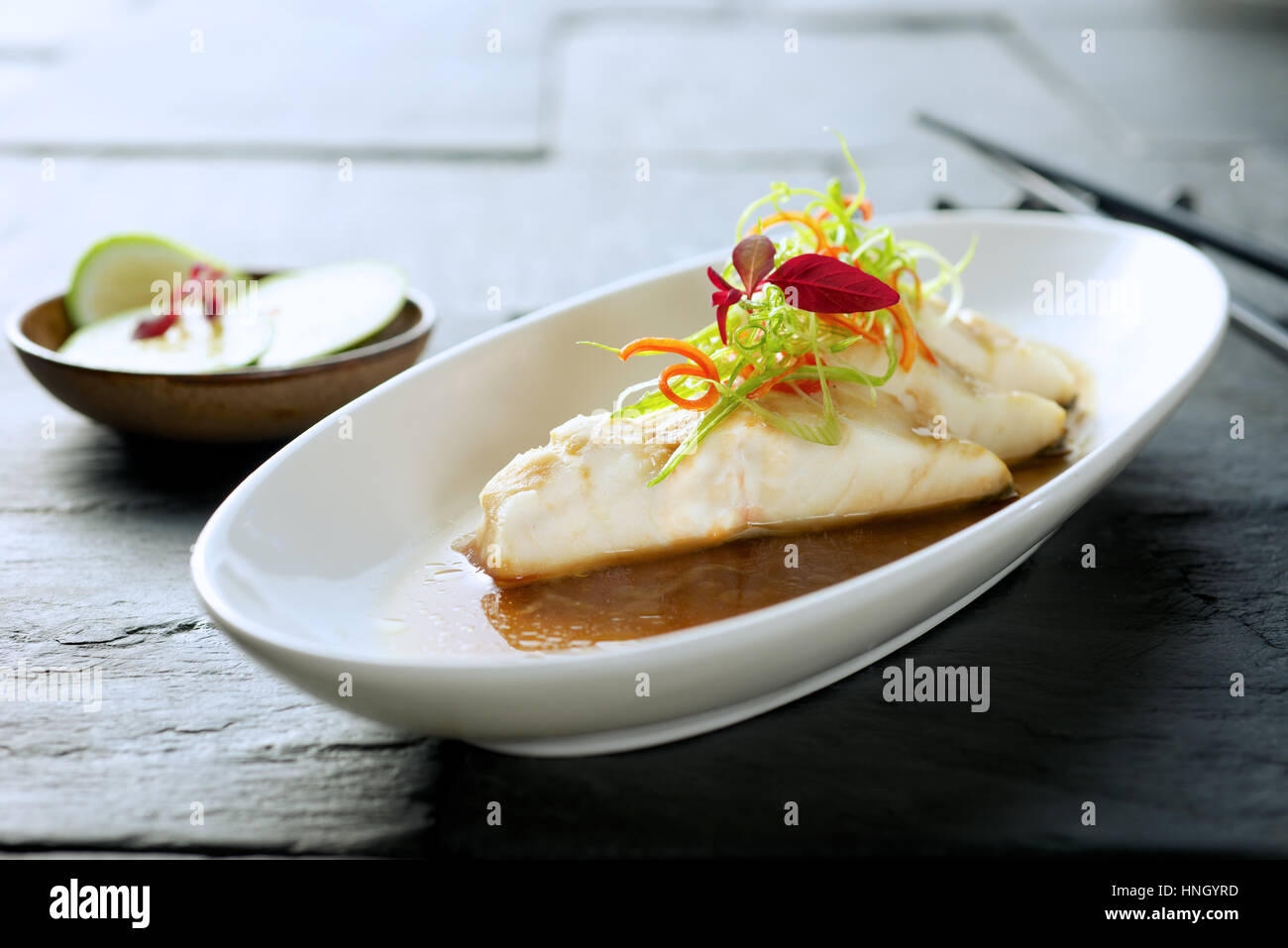 Creative fine dining fish dish on plate Stock Photo - Alamy