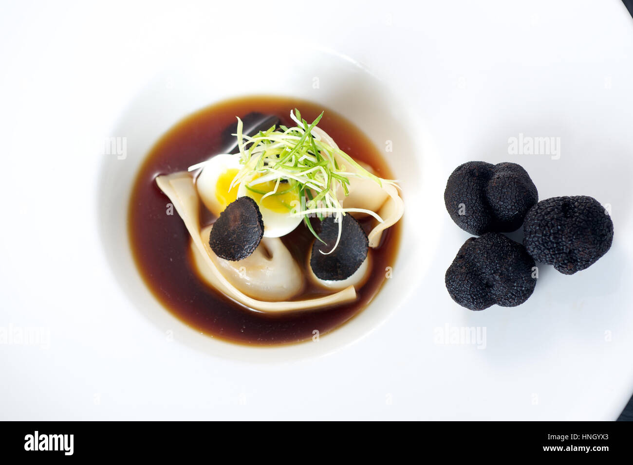 Chinese Truffle Gourmet Dumpling Dish on white plate Stock Photo - Alamy