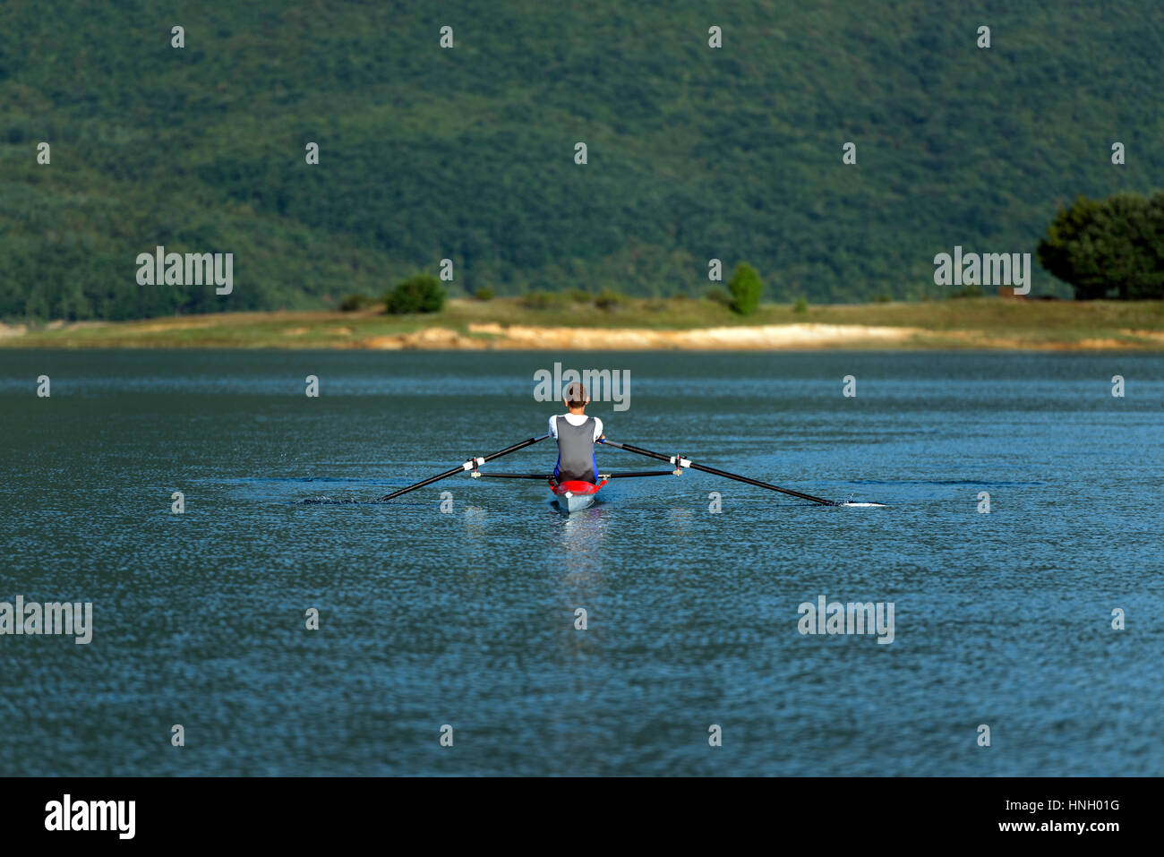 Child in the course of rowing on single Stock Photo - Alamy