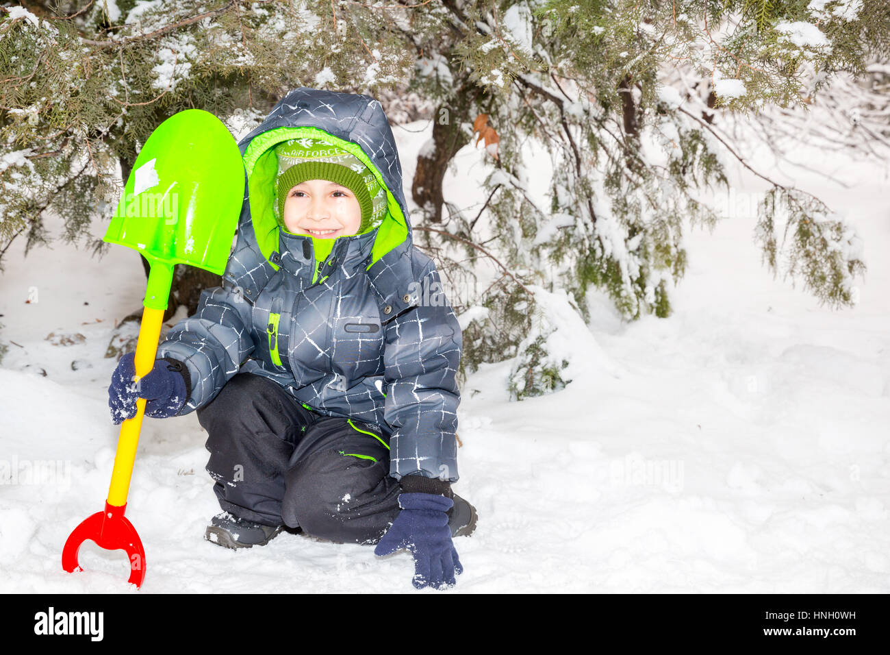 Close up portrait of adorable happy little boy grinning happily at the ...