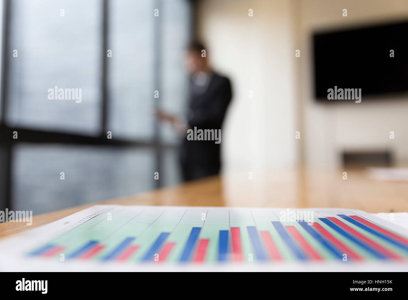 business analysis chart report with background of businessman in suit ...