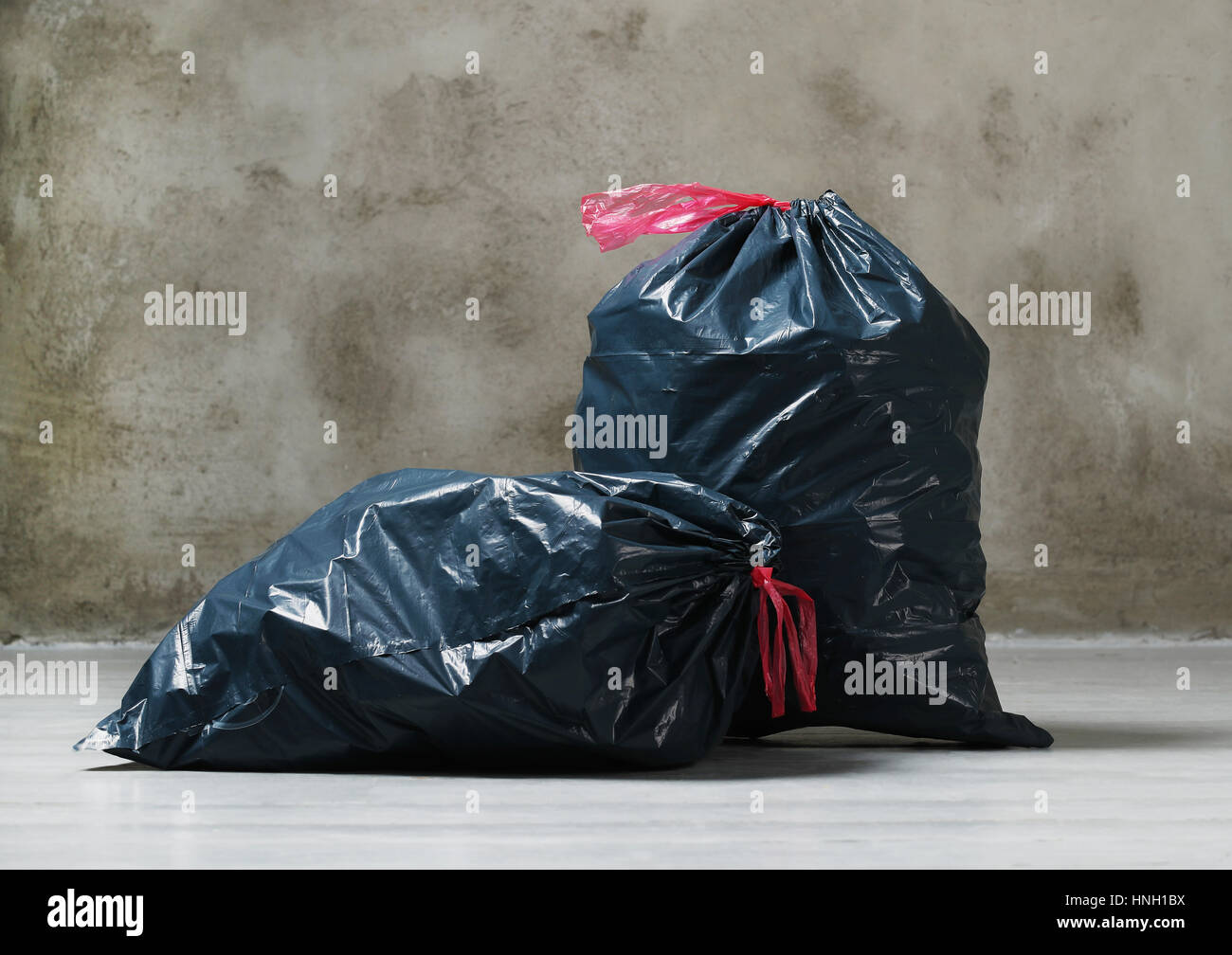 Pollution. Trash bags on the floor Stock Photo - Alamy