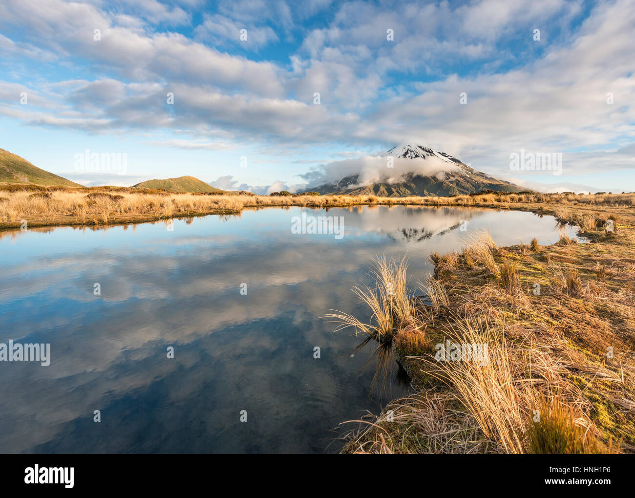Reflection in Pouakai Tarn, stratovolcano Mount Taranaki or Mount ...