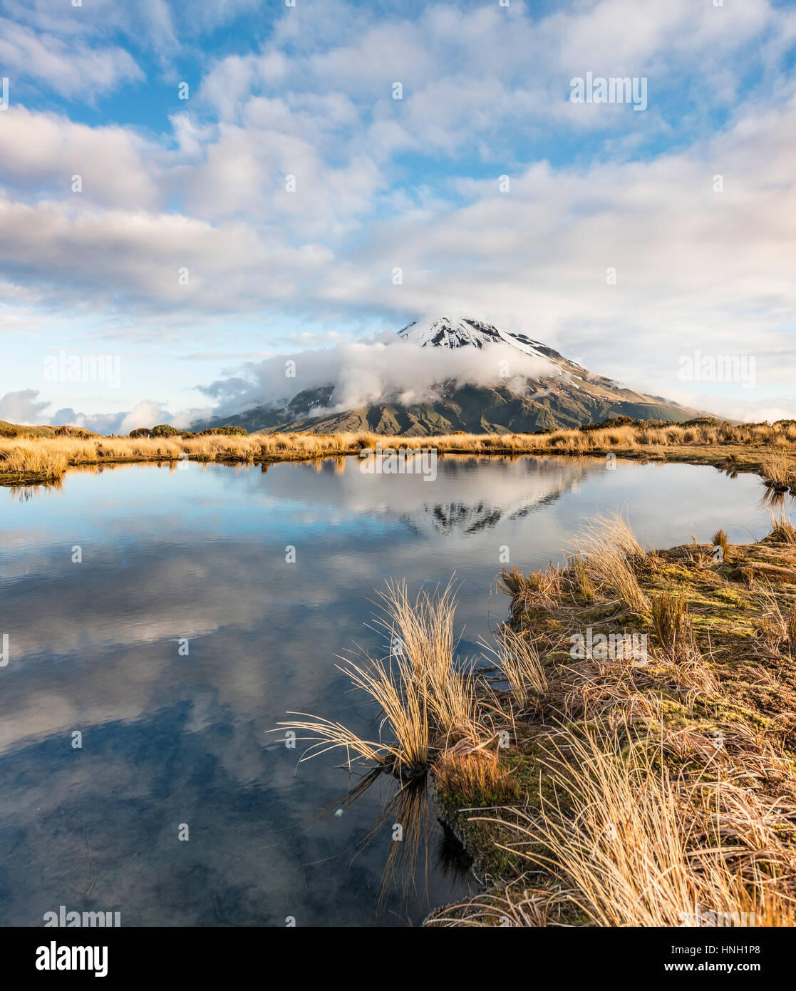 Reflection in Pouakai Tarn, stratovolcano Mount Taranaki or Mount ...