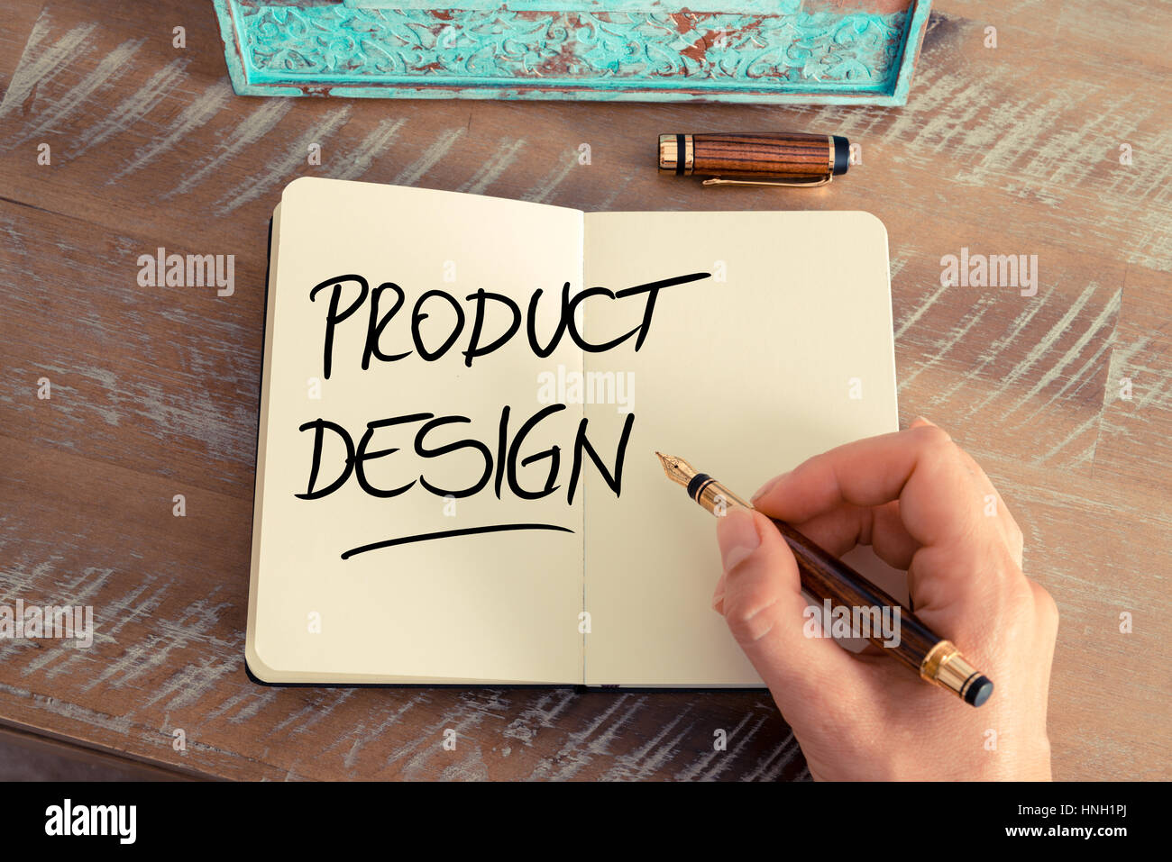 Retro effect and toned image of a woman hand writing a note with a ...