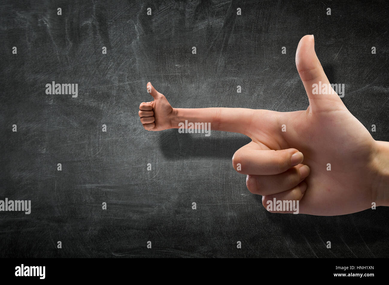 Closeup of male hand and thumb up on forefinger Stock Photo - Alamy