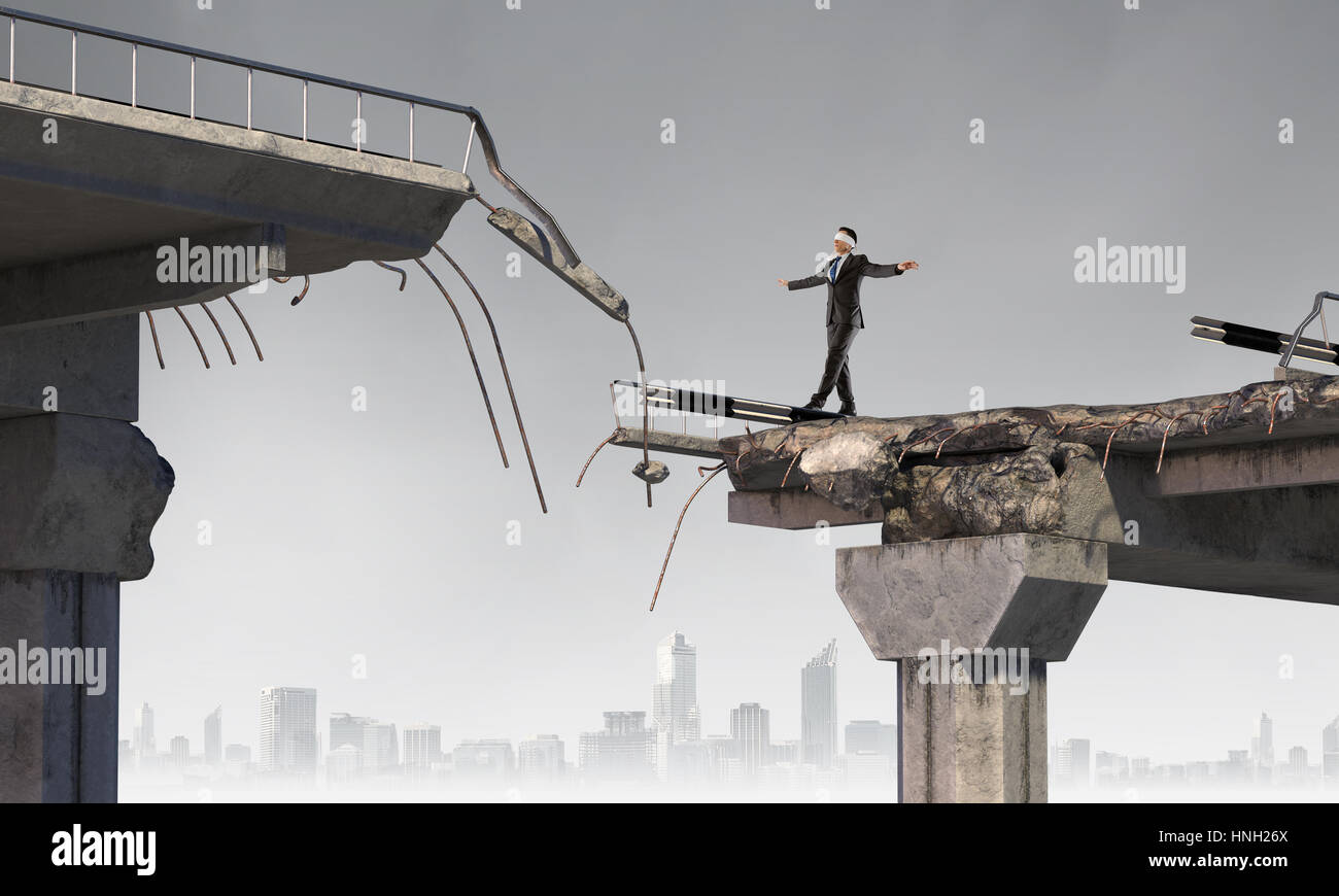 Blind businessman walking on edge of destructed bridge. Mixed media ...